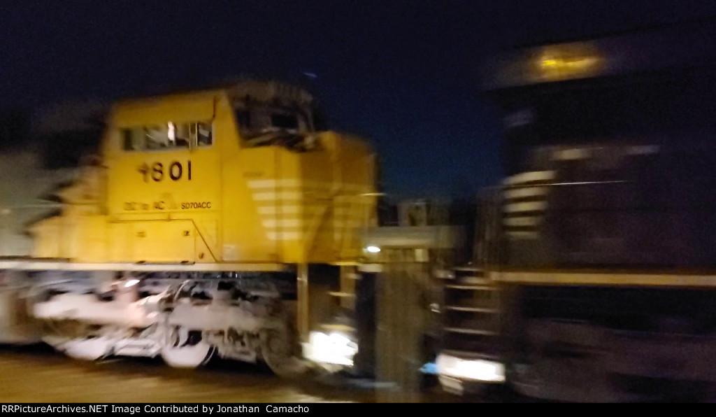 NS Yellow Mane SD70ACC 1801 flies by on a night ZAILC